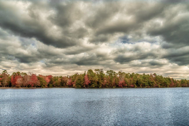Winston Porter USA New Jersey Belleplain State Forest Storm clouds over lake and forest Credit ...
